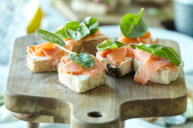 Selection of Tasty Bruschetta or Canapes with Salmon. Table Setting in ...