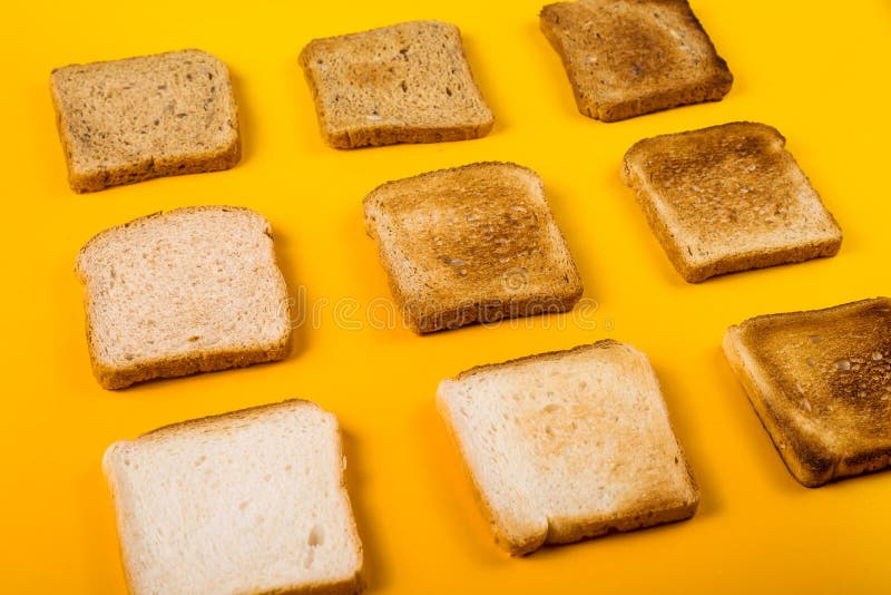 A Selection of Toast Bread for Breakfast. Minimalism on Yellow Stock ...