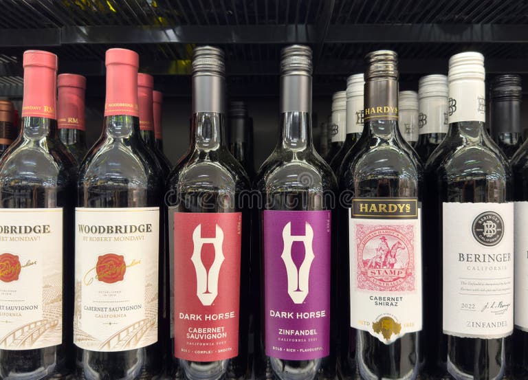 Selection of Various Red Wine Bottles on Store Shelf Editorial Stock ...