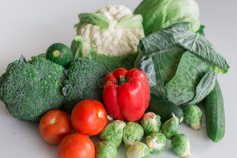Selection of Vegetables on a White Surface Stock Photo - Image of ...