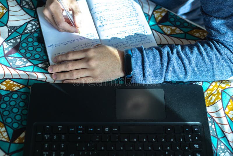 Selective Close-up of a Student S Hand Taking Notes in a Notebook and ...