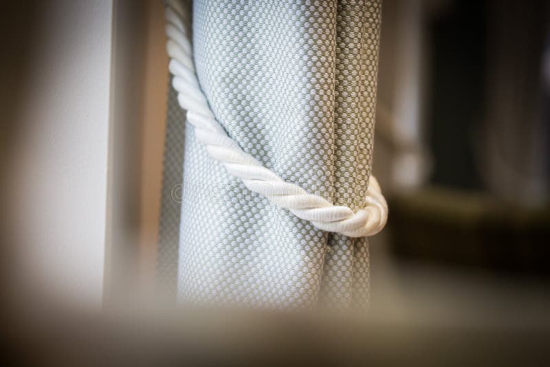 Selective Closeup of a Gray Curtain Tied with a Rope Stock Photo ...