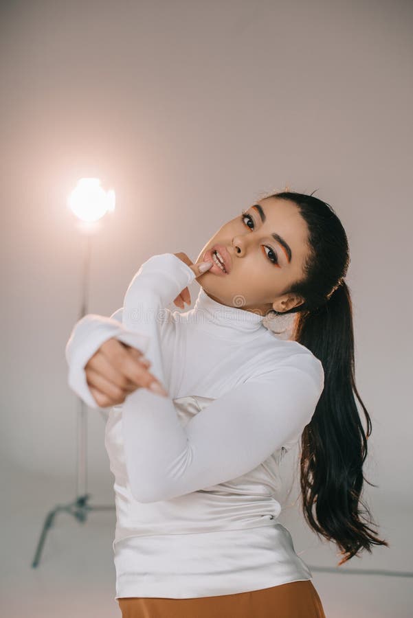 Selective Focus of African American Female Model in White Turtle Neck ...