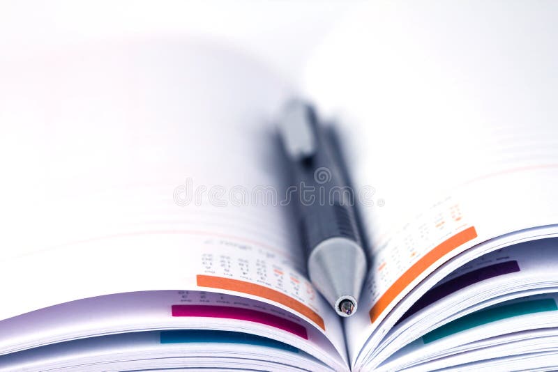 Selective Focus of Ball Pen on Opened Lined Diary Book with Calendar ...
