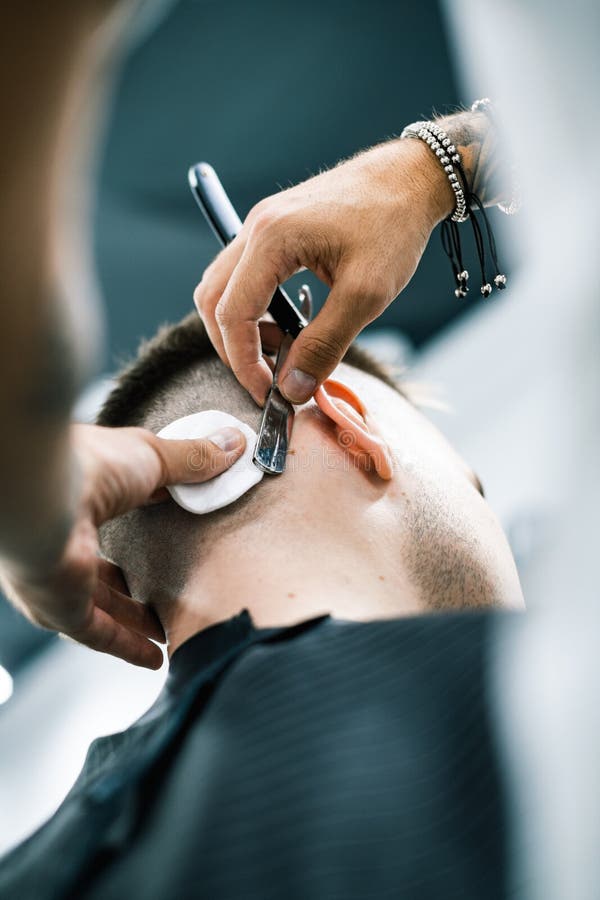 Barber Using Shaving Razor on Neck of Client in Barbershop Stock Photo ...