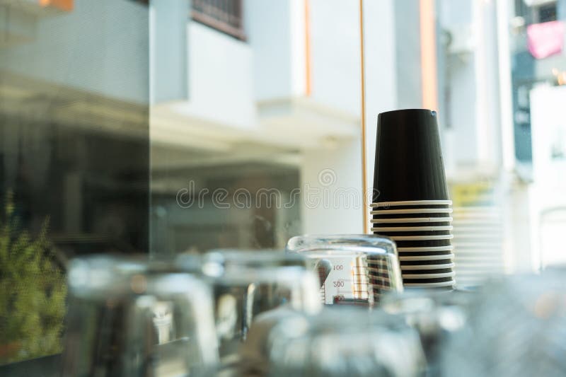 Selective Focus of Black Paper Coffee Cup Stacking Above Coffee Machine ...