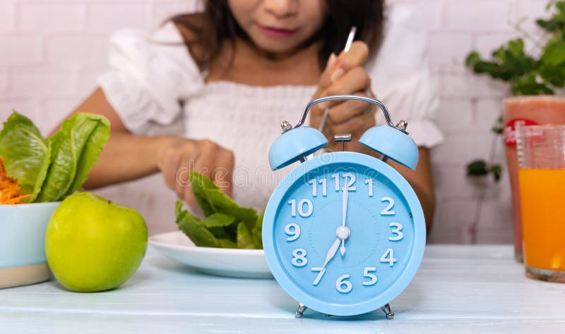 Selective Focus of Blue Clock with Schem of Eating and Interval Fasting ...