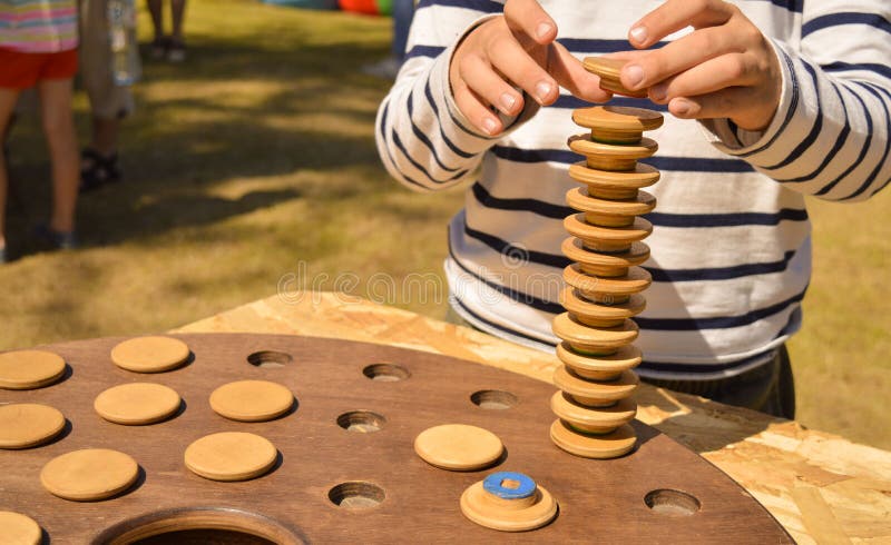 A Selective Focus of a Boy Who Assembles a Turret from the Details of a ...