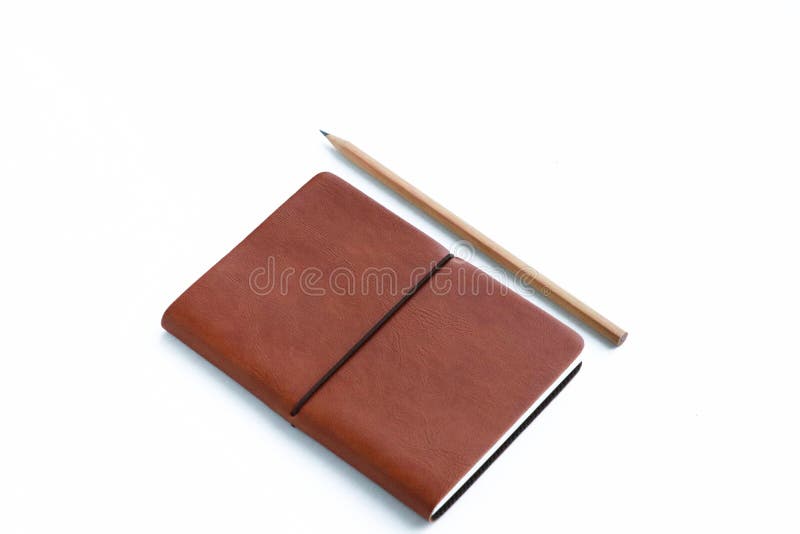 Selective Focus of Brown Leather Cover Notebook and Sharp Pencil on ...