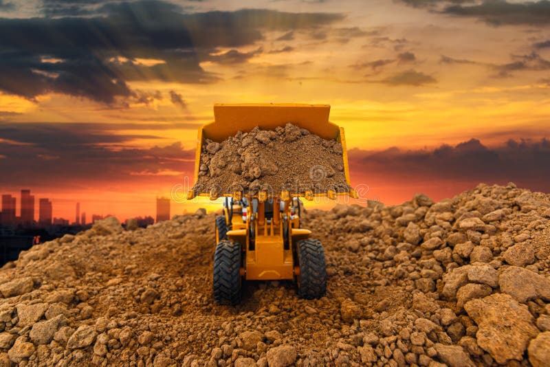 Selective Focus with Bucket,Wheel Loader are Digging the Soil in the ...