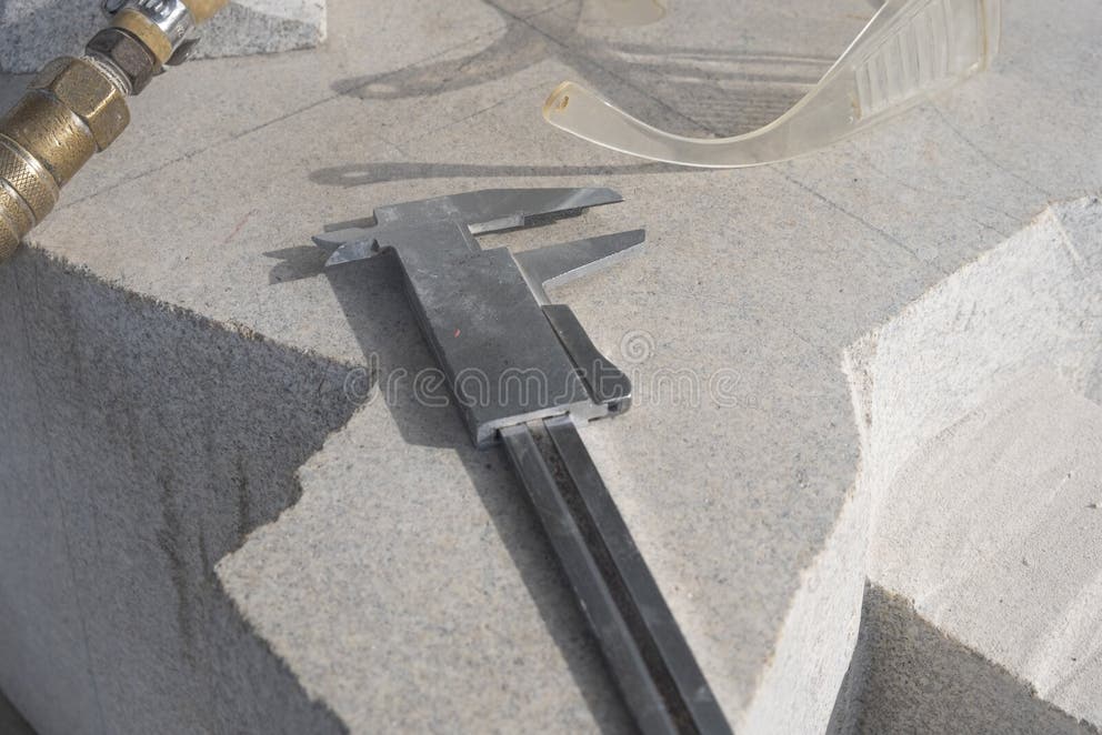 Selective Focus, Caliper and Goggles on a Granite Stone Stock Image ...