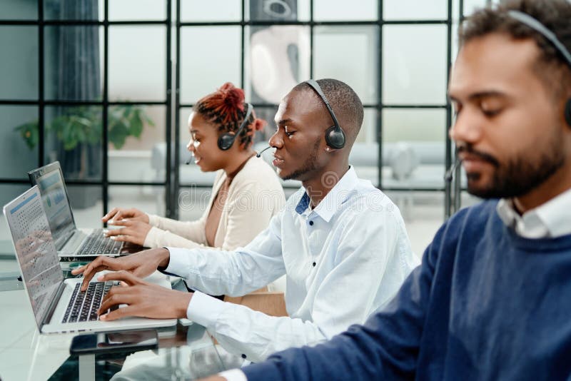 Call Center Operator in Headset Working in Office. Stock Photo - Image ...