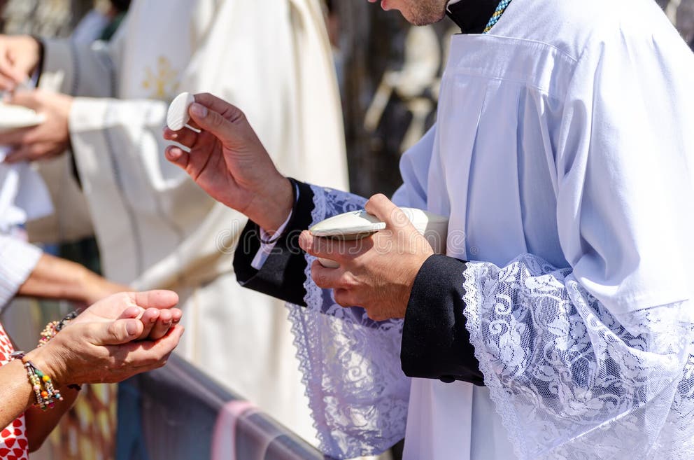Selective Focus, Catholic Priests Distributing the Communion Wafer ...
