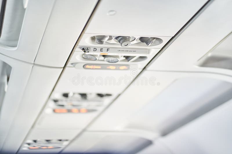 Selective Focus on the Ceiling of a Passenger Aircraft, Where Safety ...