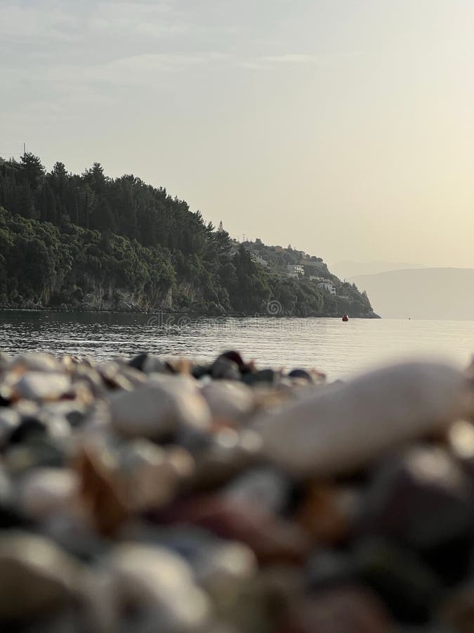 Selective Focus on a Coastal Cliff with Houses on with Small Rock in ...