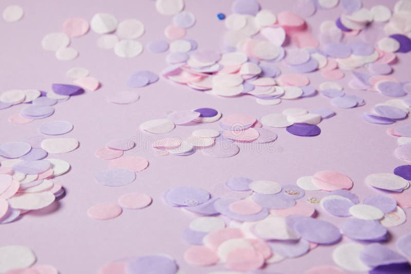 Selective Focus of Confetti Pieces on Violet Surface Stock Photo ...