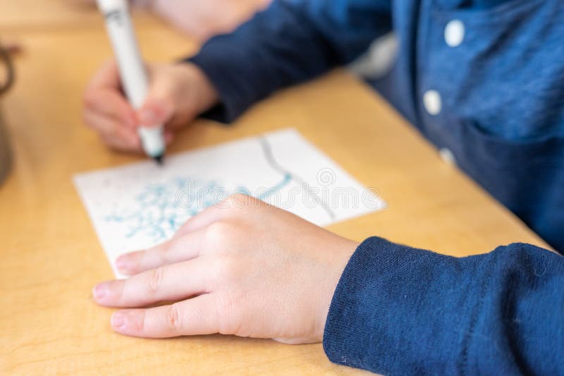 Selective Focus on a Crafting Table Surface with a Defocused Child ...