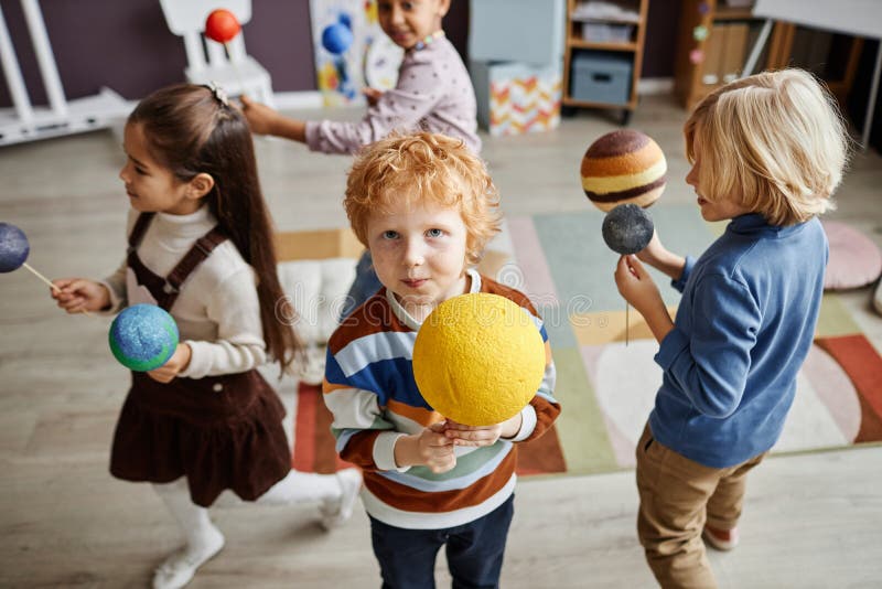 Selective Focus on Cute Little Boy Holding Model of Sun Stock Photo ...