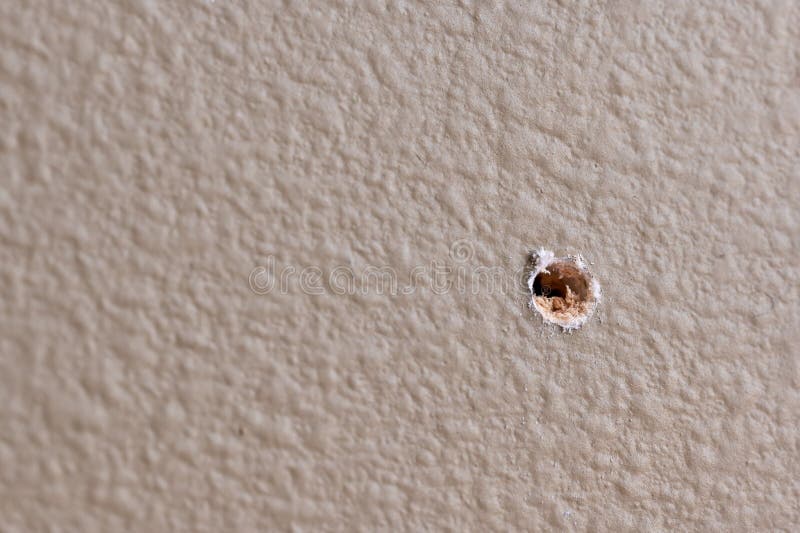 Selective Focus on Drilled Hole through Drywall with Bits of Insulation ...