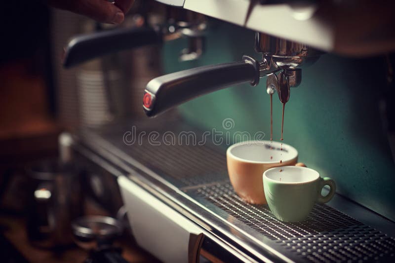Selective Focus of Espresso Device, Pouring Jet of Coffee into Two Cups ...