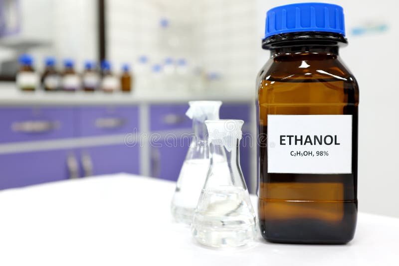 Ethanol in a Bottle on the Table with of Microscope Virus Close Up and ...