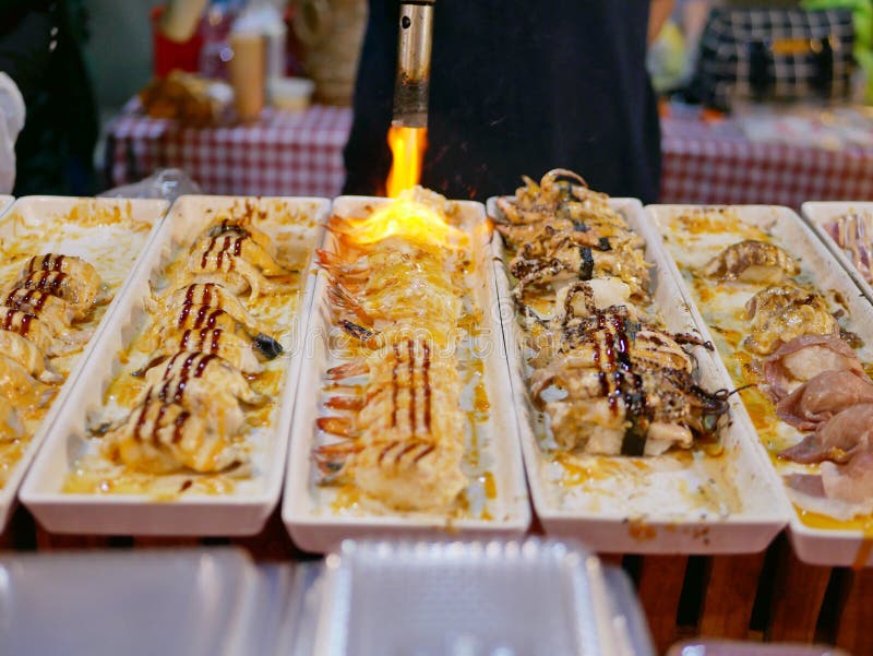 Selective Focus of Fire from a Fire Gun on Cooking Sushi Stock Image ...