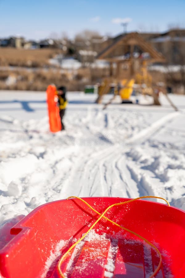 Selective Focus on the Front End of a Sled Looking Down a Snow Path in ...
