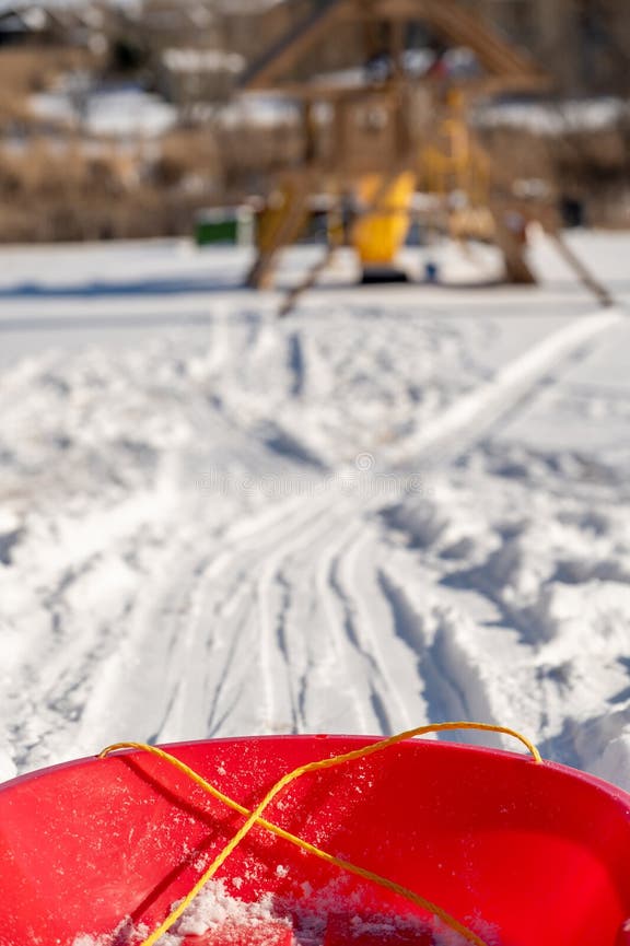 Selective Focus on the Front End of a Sled Looking Down a Snow Path in ...