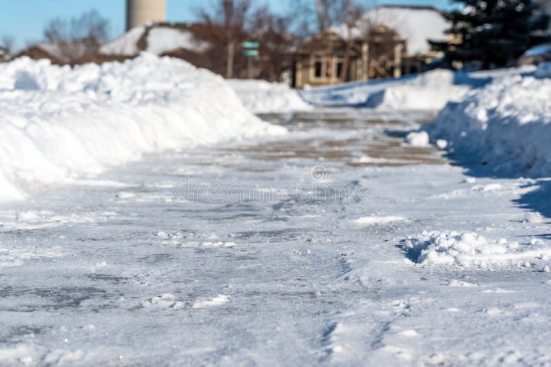 Selective Focus Ground Level View of Snow Blown Sidewalk Section with ...
