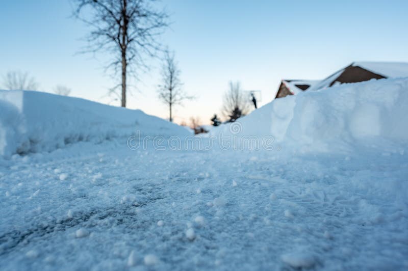Selective Focus Ground Level View of Snow Blown Sidewalk Section with ...