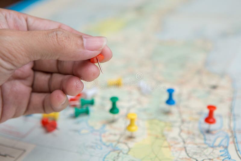 Selective Focus of Hand Holding a Pin on Map Background Stock Photo ...