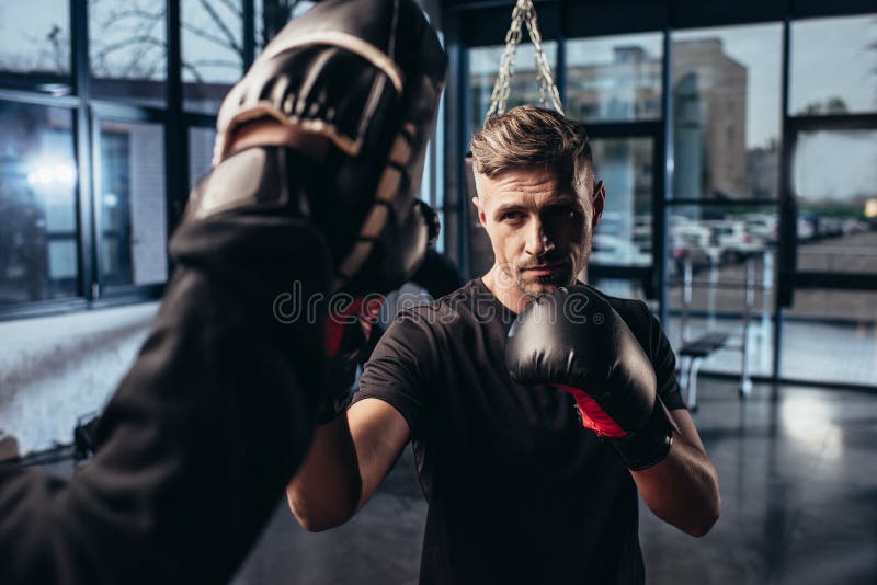 Selective Focus of Handsome Boxer Exercising with Trainer Stock Image ...