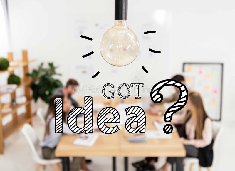 Selective Focus of Light Bulb and Multicultural Group of Marketing ...