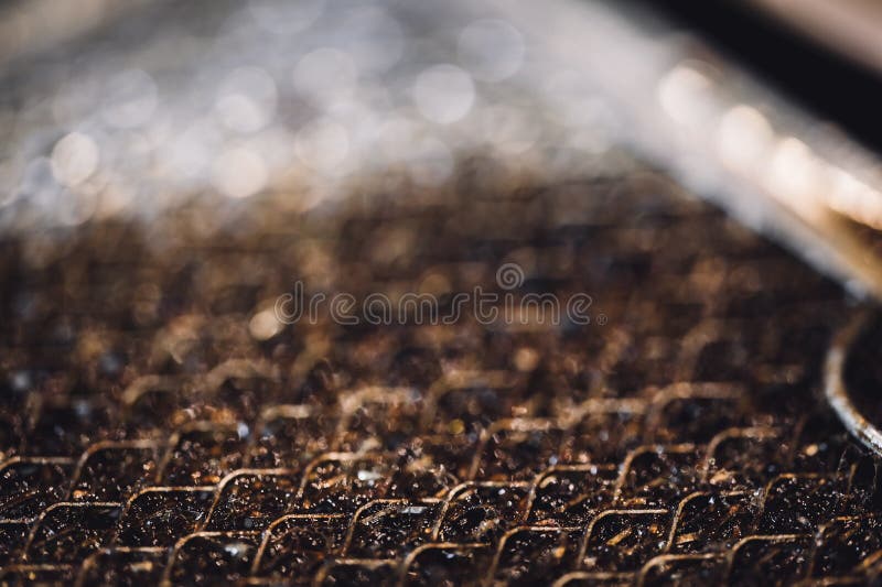 Selective Focus Macro of a Dirty Kitchen Range Hood Filter Clogged with ...