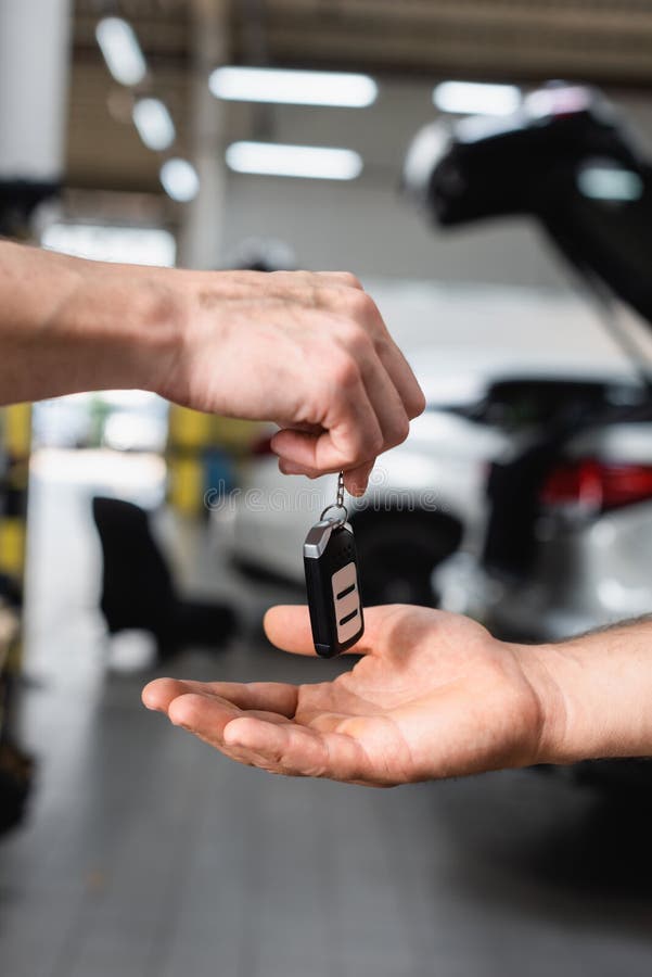 Selective Focus of Man Receiving Car Stock Photo - Image of taking ...
