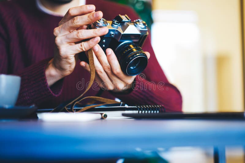 Selective Focus on Man`s Hands Holding Vintage Camera with Modern Lense ...