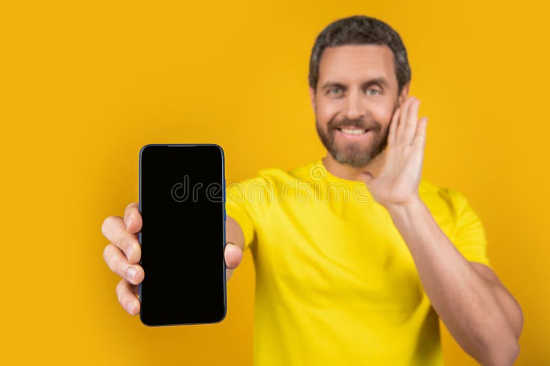 Selective Focus of Man Showing Smartphone App in Studio. Image of Man ...