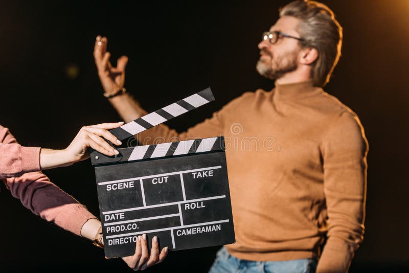 Mature Actor Performing Role with Clapboard Stock Photo - Image of ...