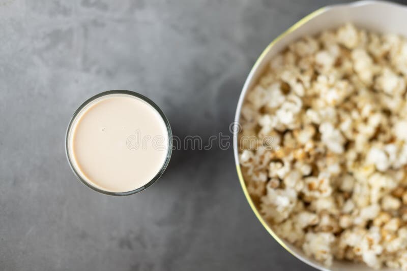 Selective Focus on Milk Tea in Glass with a Big Bowl Popcorn Stock ...