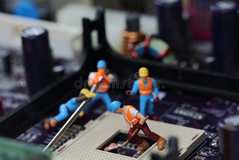 Selective Focus of Miniature Engineer and Worker Fixed and Repair CPU ...
