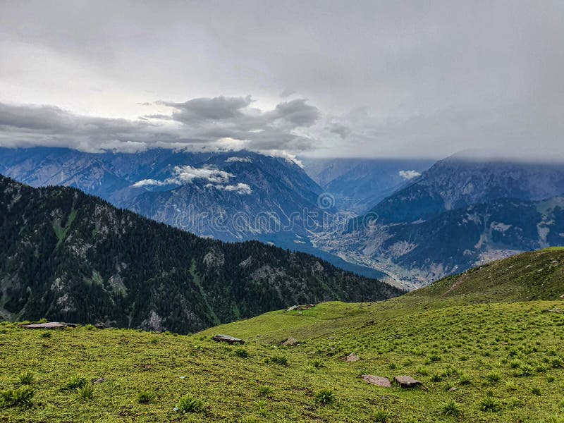A Selective Focus on Mountains at Blur View of Clouds at Top of the ...