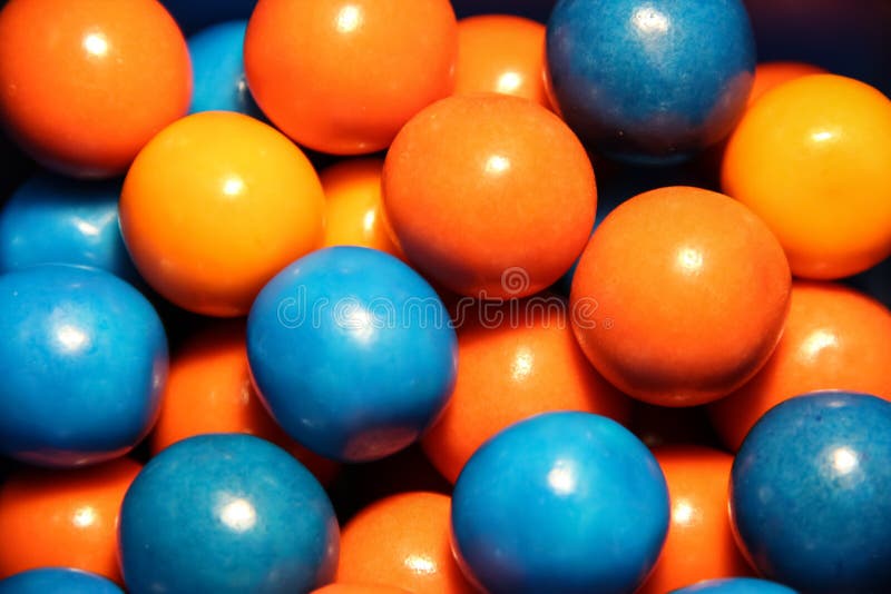 Selective Focus of Neat Set of Orange and Blue Colored Round Candy ...