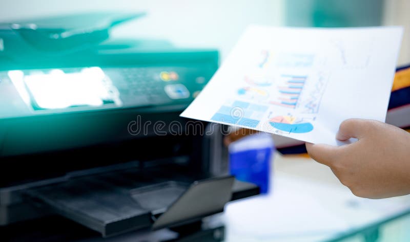 Selective Focus on Office Worker Hand Holding Paper. Multifunction ...