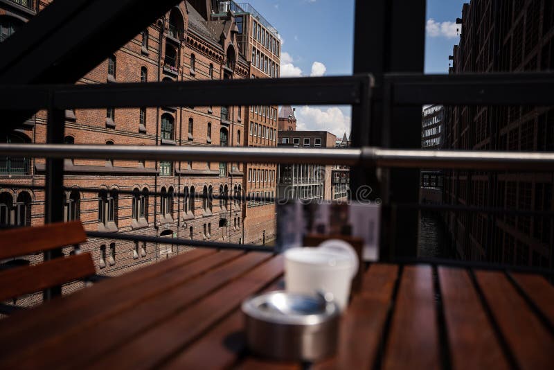 Selective Focus on Old Buildings in a City Wtih Cafe Table Foreground ...