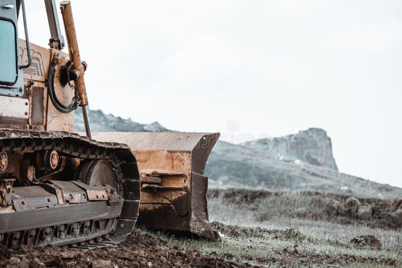 Selective Focus of Old and Rusty Caterpillar Equipment on the Land ...