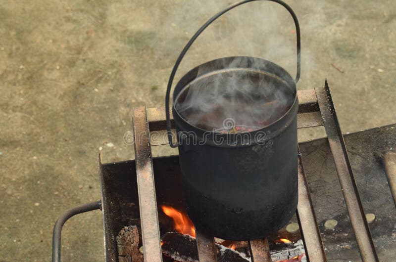 With Selective Focus. Outdoor Kitchen. on the Fire is Preparing Tea ...