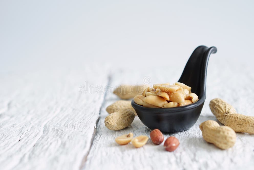 Selective Focus at Peeled Peanuts in White Wooden Plank Stock Image ...