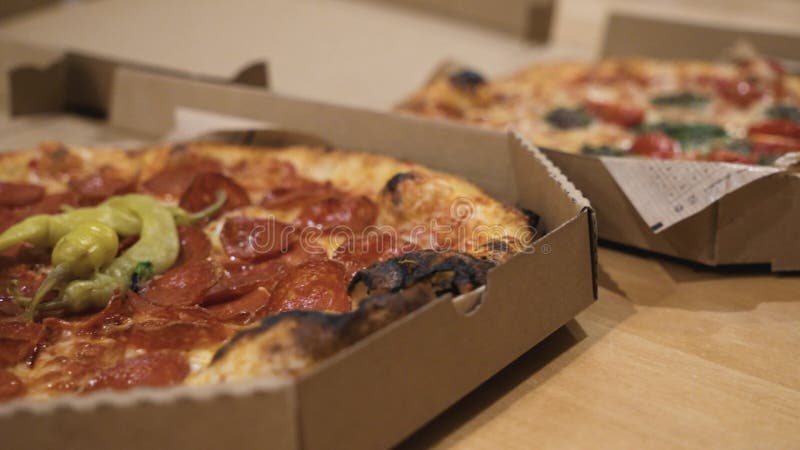 Selective Focus of Pepperoni Pizza with Green Chilies in Pizza Box on ...