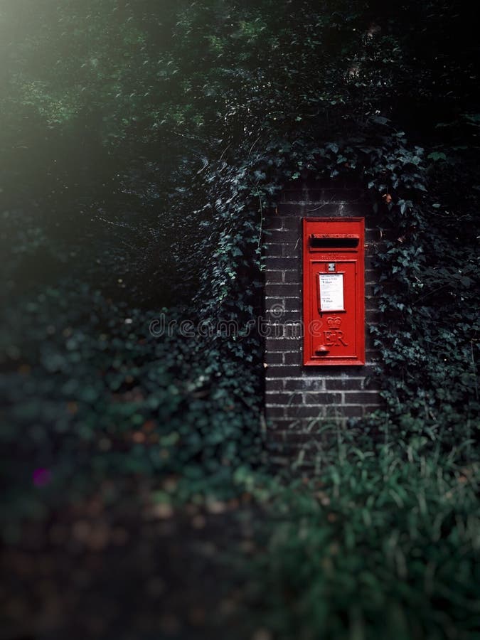 Selective Focus Photography of a Red Postbox or a Mailbox on a Brick ...