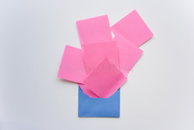Selective Focus, Pink Paper Stickers in Chaos and Blue Envelope on the ...